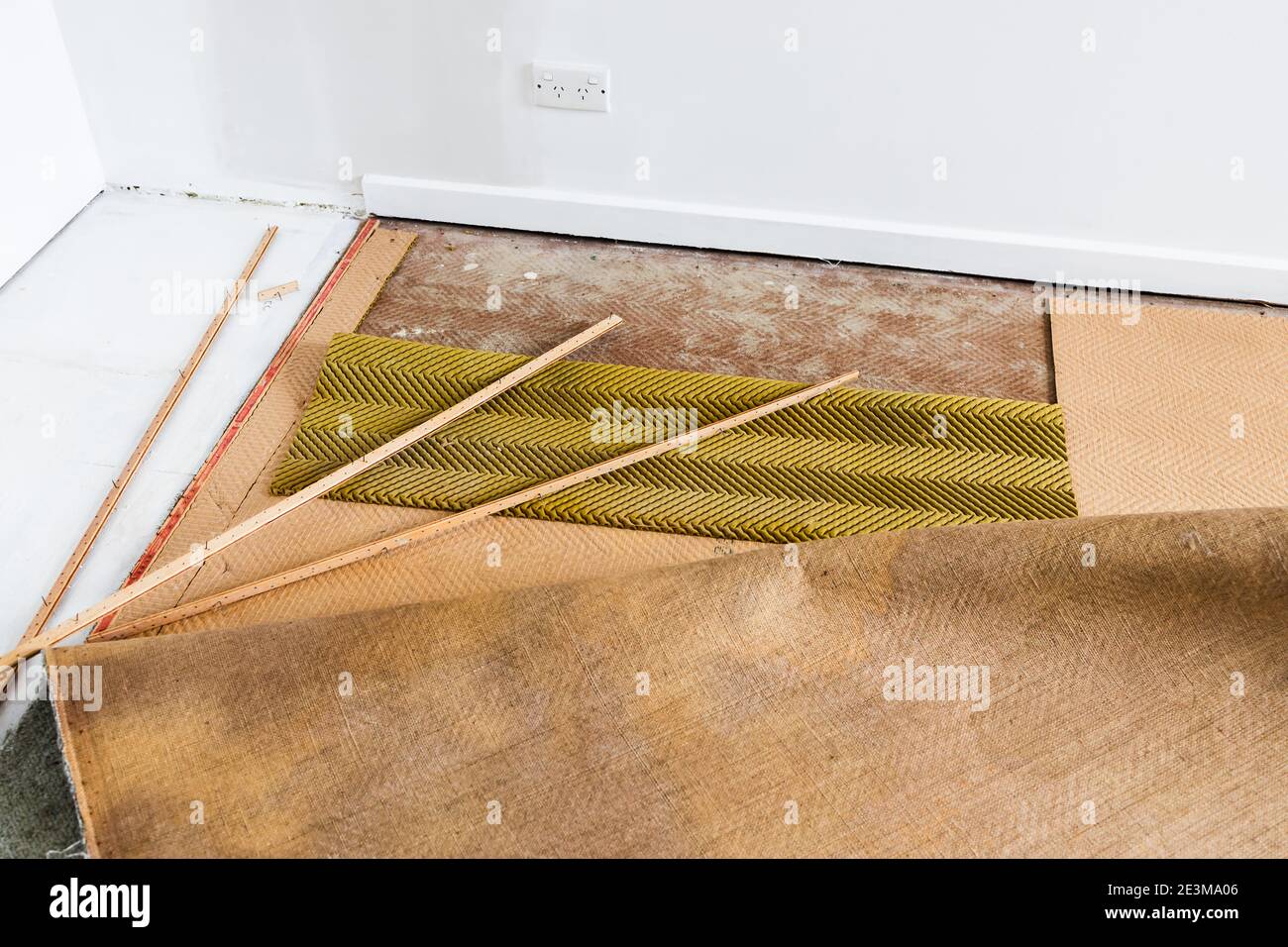 home improvement and DIY concept, ripping up the carpet and underlay ...