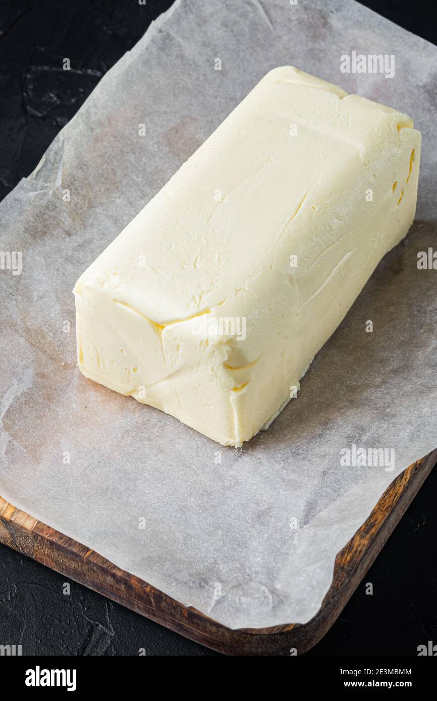 Rustic farmhouse inspired fresh butter, on black background Stock Photo ...