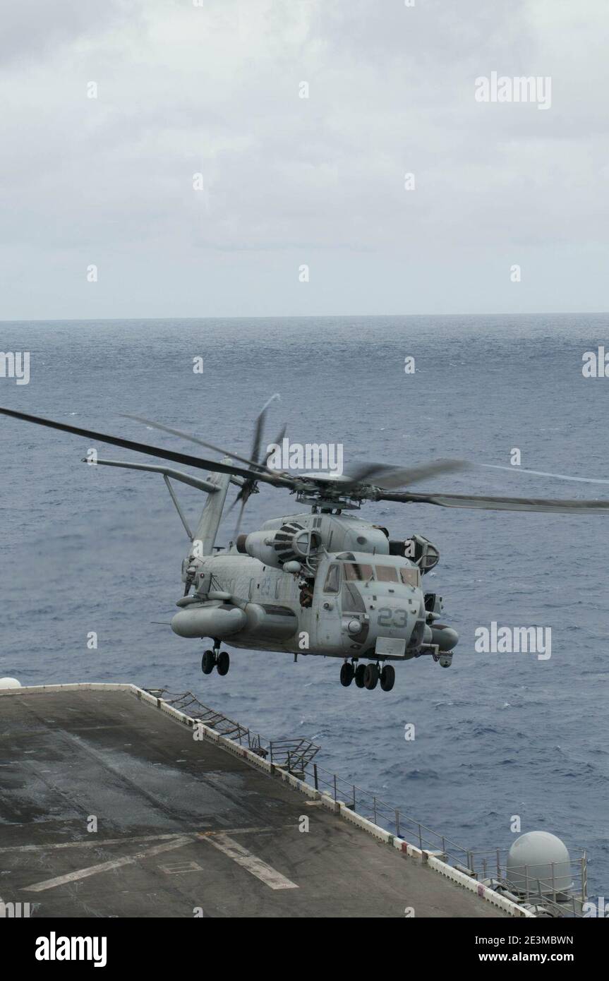 Marines fast rope onto flight deck of USS Peleliu 121005 Stock Photo ...