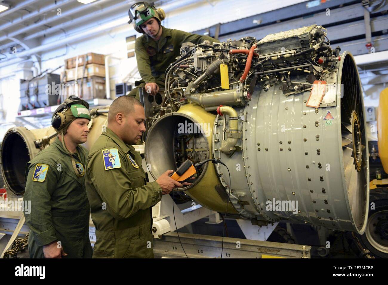 Marines examine an AV-8B engine at sea. (8456178520 Stock Photo - Alamy