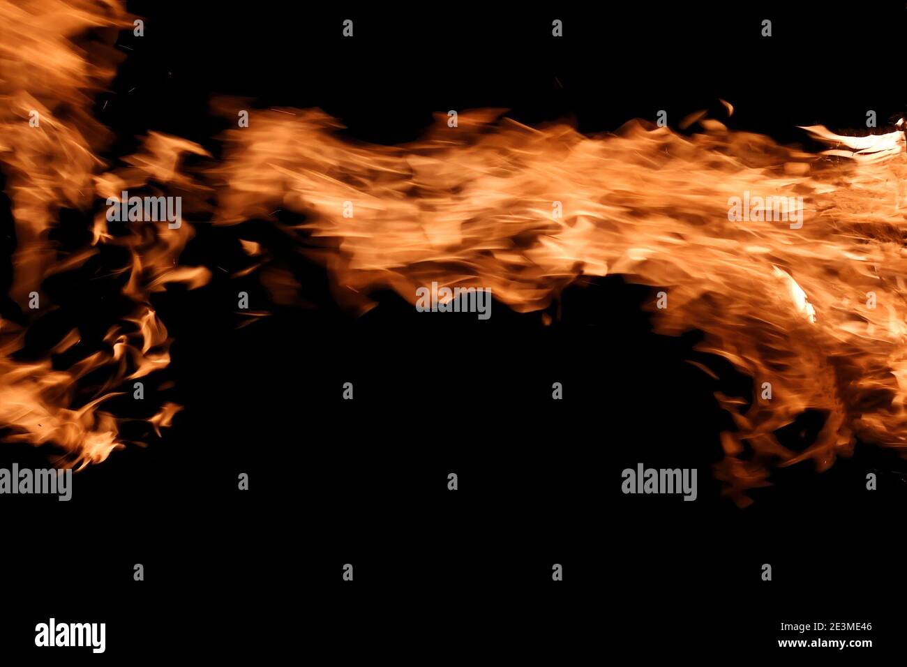 Fire burst, flames and sparks on the black background. Symbol of ...