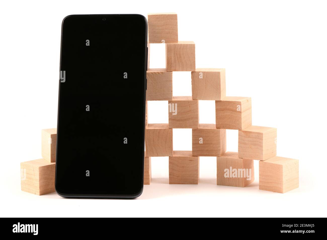Black mobile smartphone and wooden cubes. Smartphone with blank screen ...