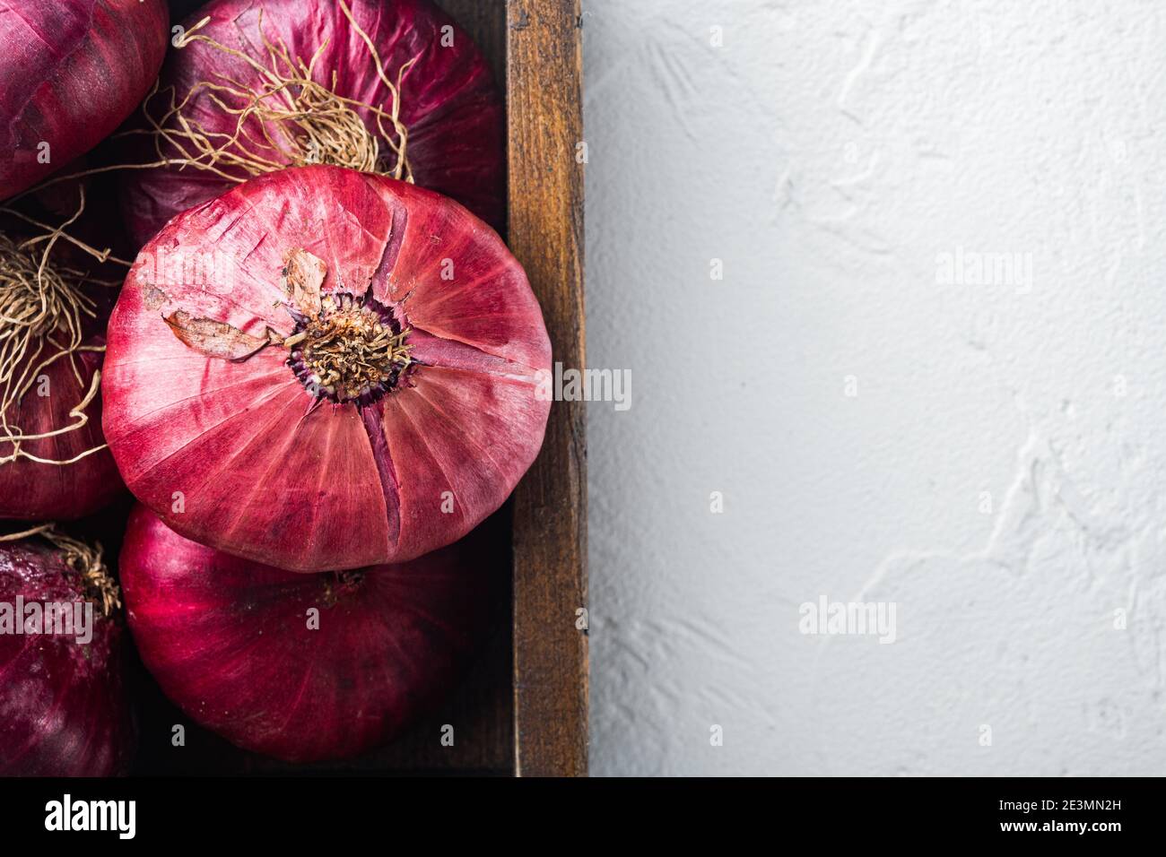 Fresh whole red onions, on white background, top view flat lay with ...