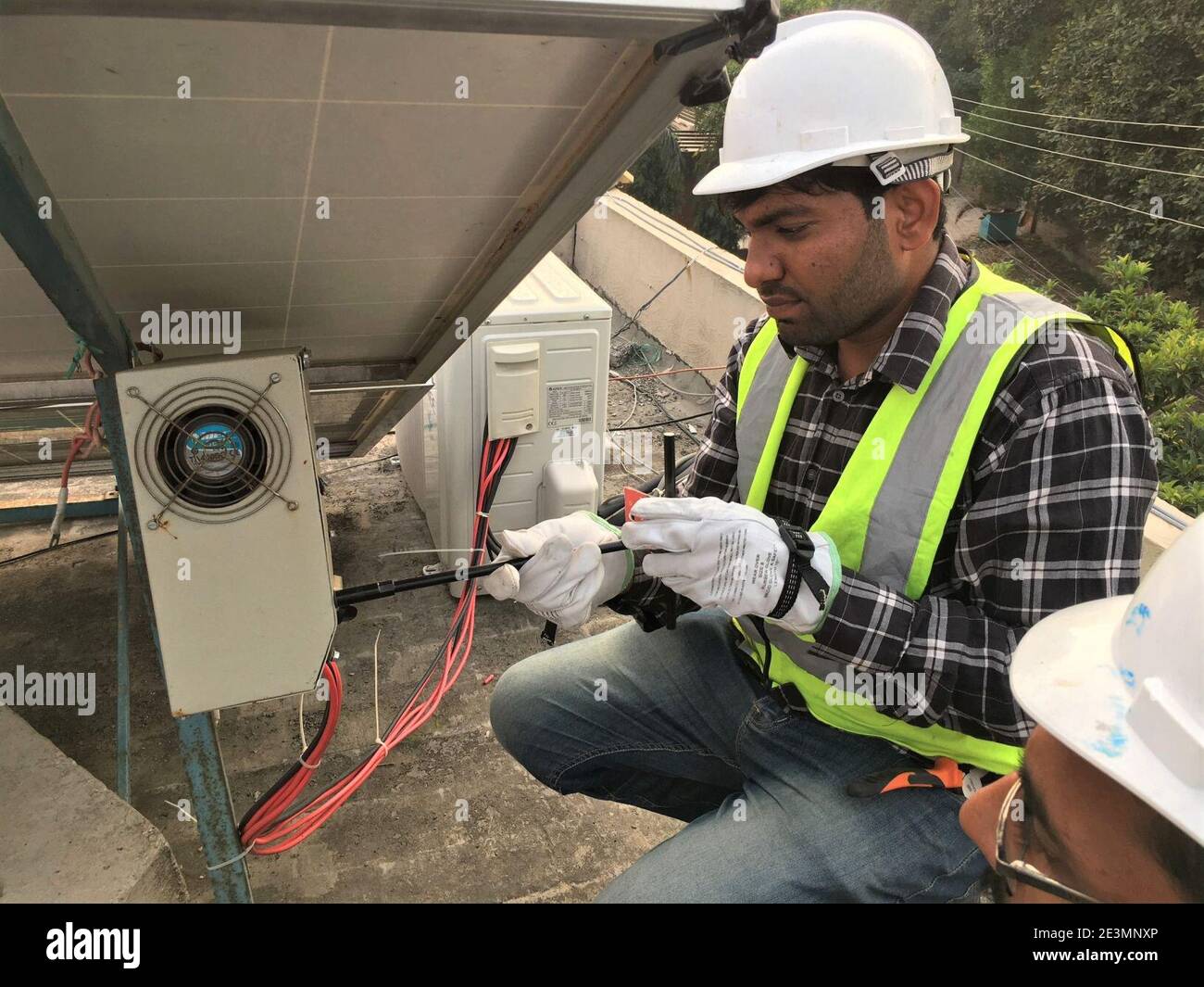 Man installating a solar panel Stock Photo - Alamy