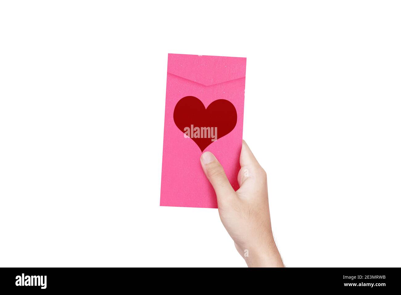 Human hand holding a pink envelope with heart shape isolated over white ...