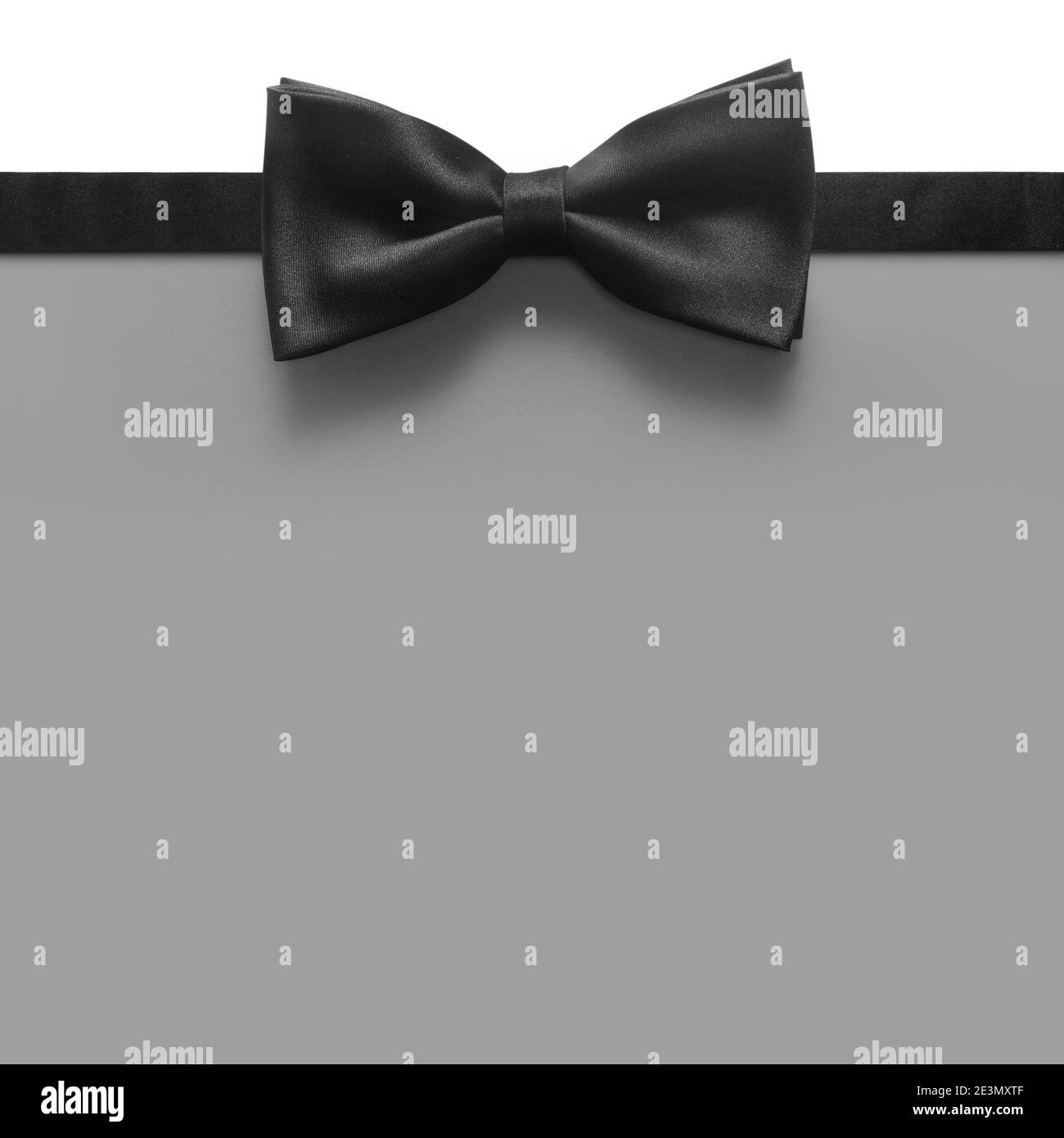 black bow tie with grey background Stock Photo - Alamy