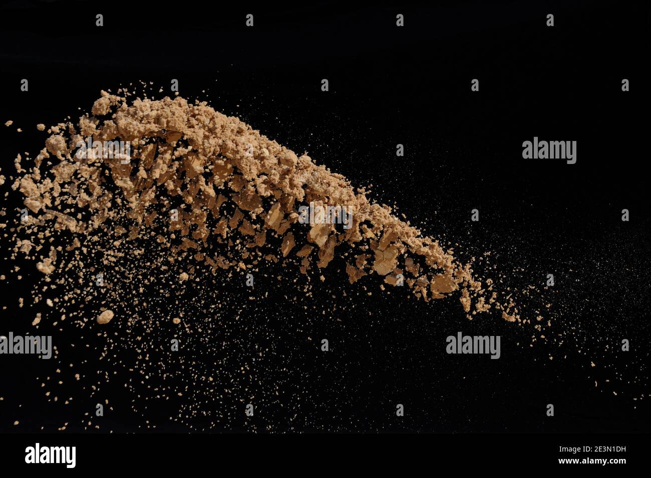 Pile of soil dropping isolated on black background Stock Photo - Alamy