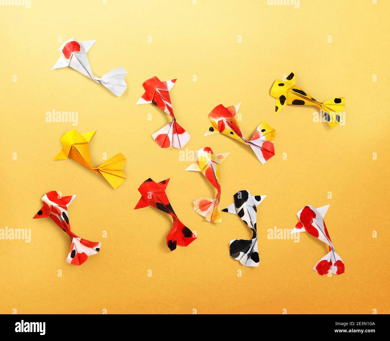 handmade paper craft origami koi carp fish on yellow background Stock ...
