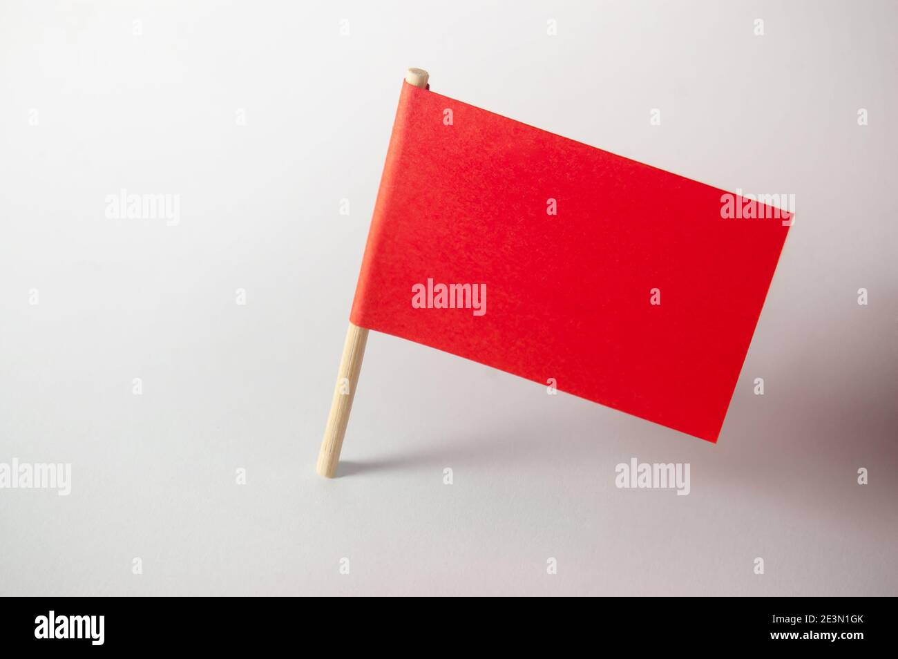 Miniature blank red flag. Ready for a Message. Paper flag Isolated on ...