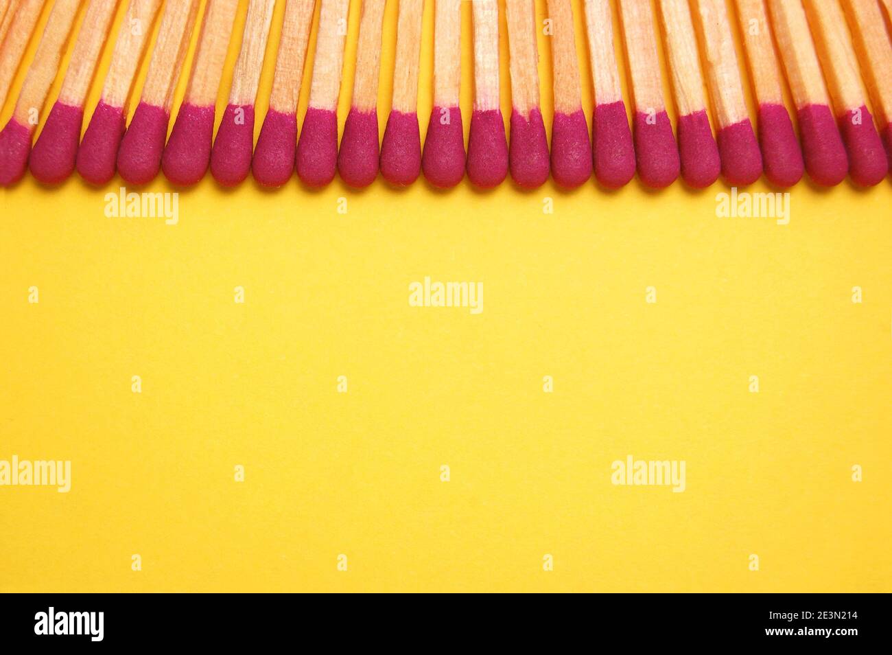 Wooden matches on top of yellow paper Stock Photo - Alamy