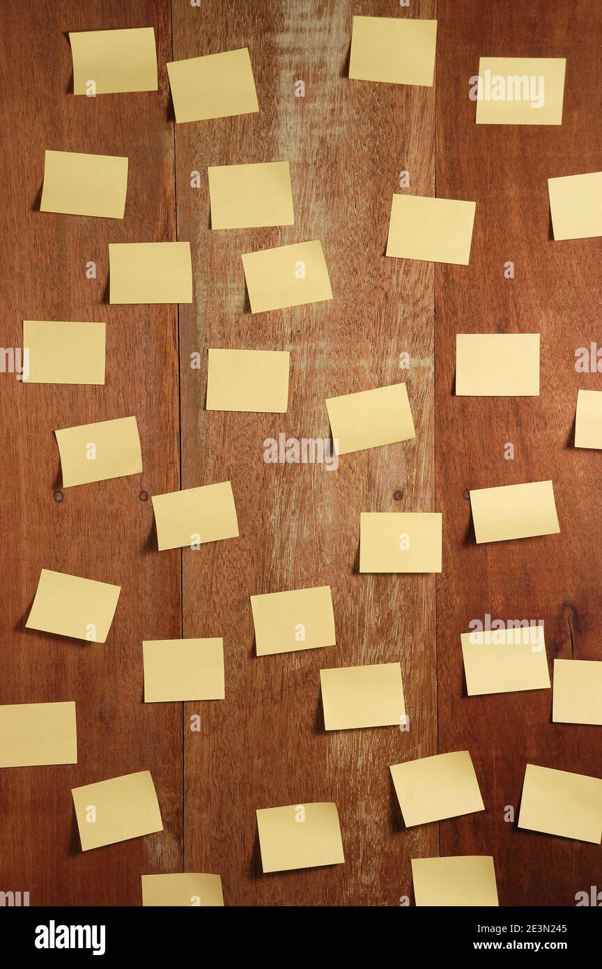 Many blank sticky note paper sheets on old wooden background Stock ...