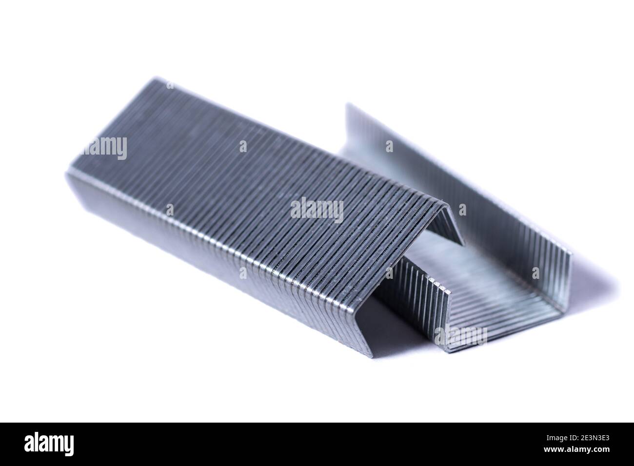 Blue stapler and staples Isolated on white background Stock Photo - Alamy