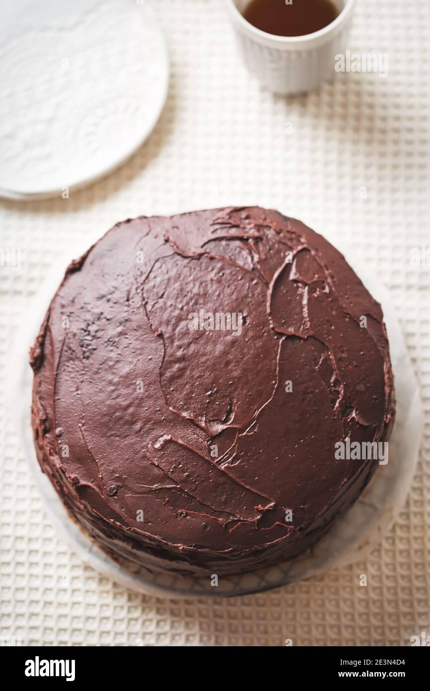 Ganache frosting chocolate sponge layer cake hi-res stock photography ...