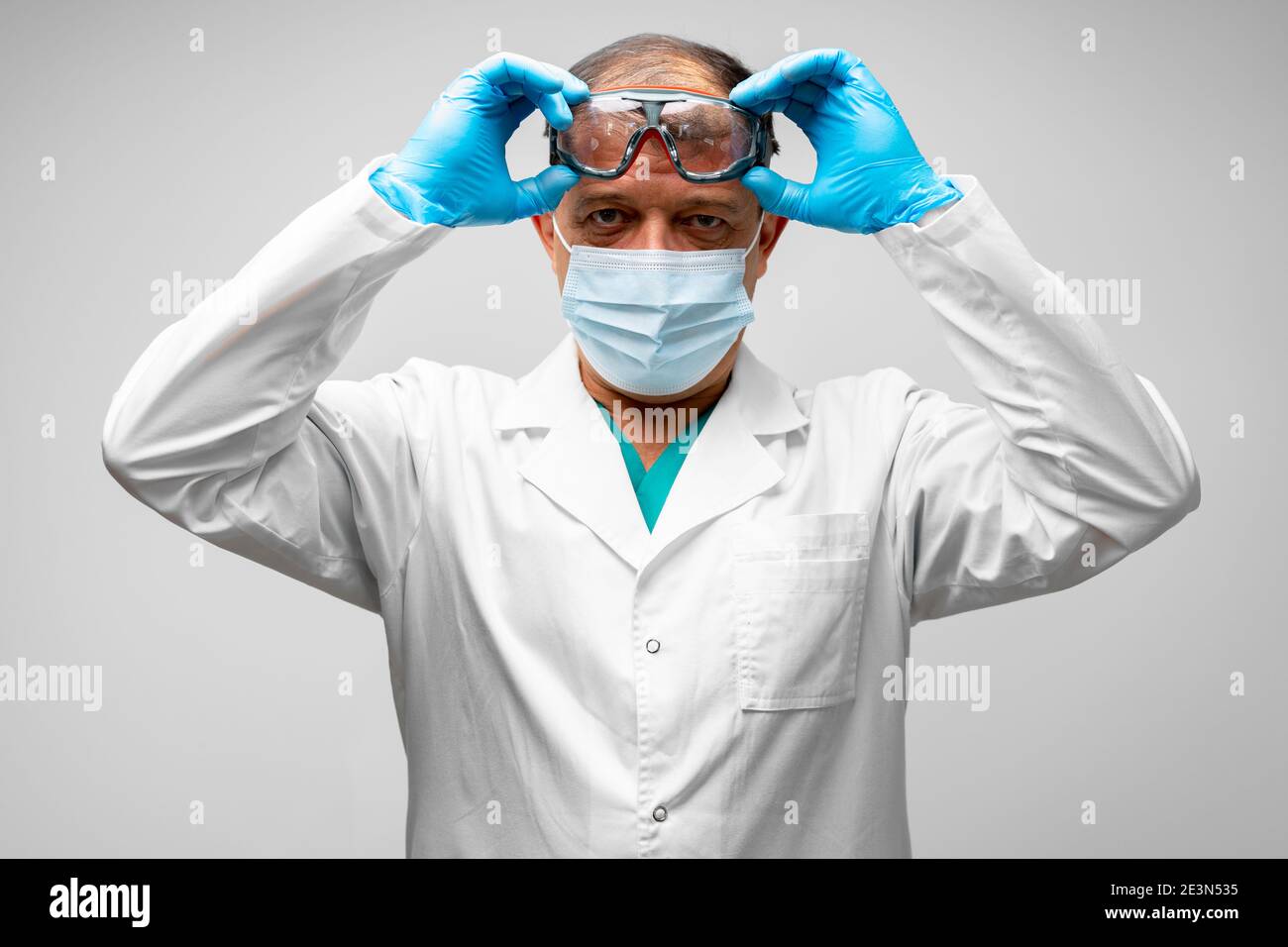 Man taking off coat hi-res stock photography and images - Alamy