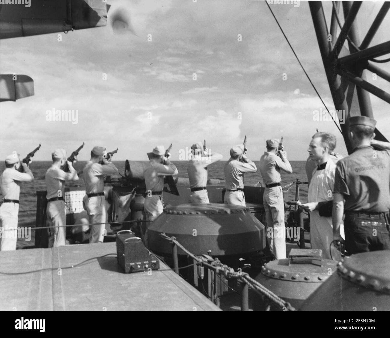 Marines on USS Honolulu (CL-48) fire salute at funeral services for USS ...