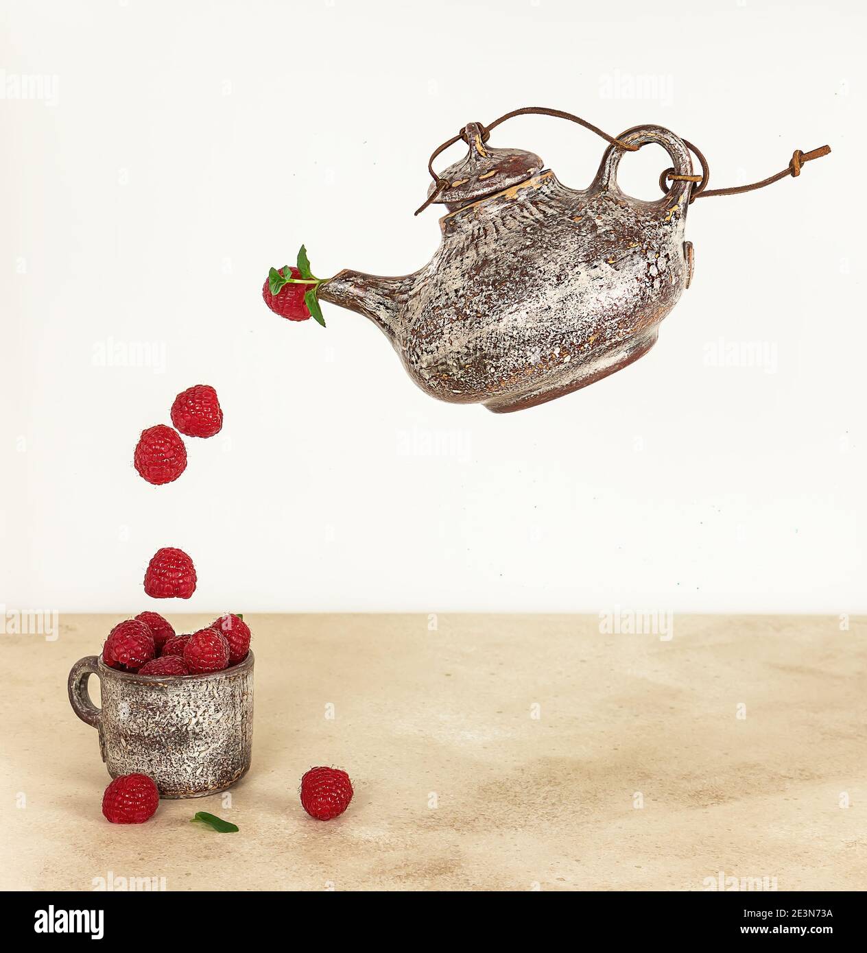 Flying raspberry from teapot. Levitation photo, summer concept Stock ...
