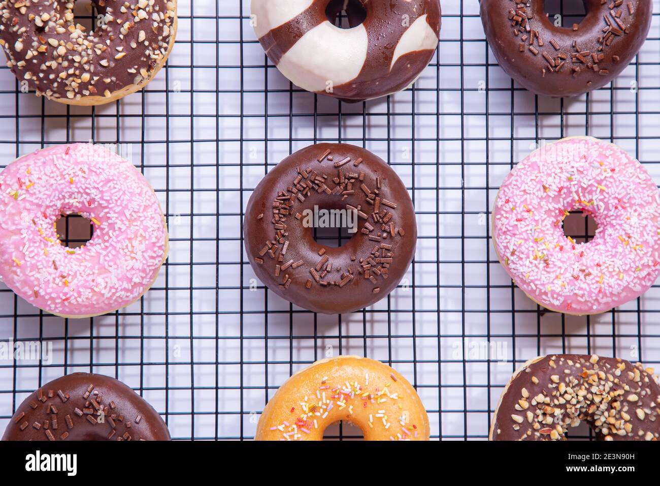 Flat lay composition of mixed donuts on white background Stock Photo ...
