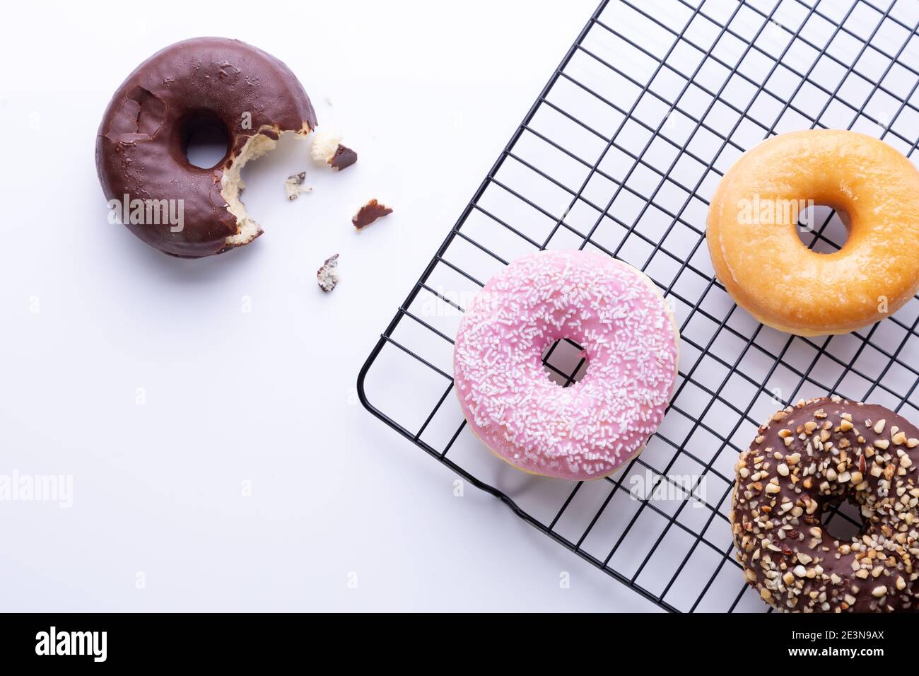 Flat lay composition of mixed donuts on white background Stock Photo ...