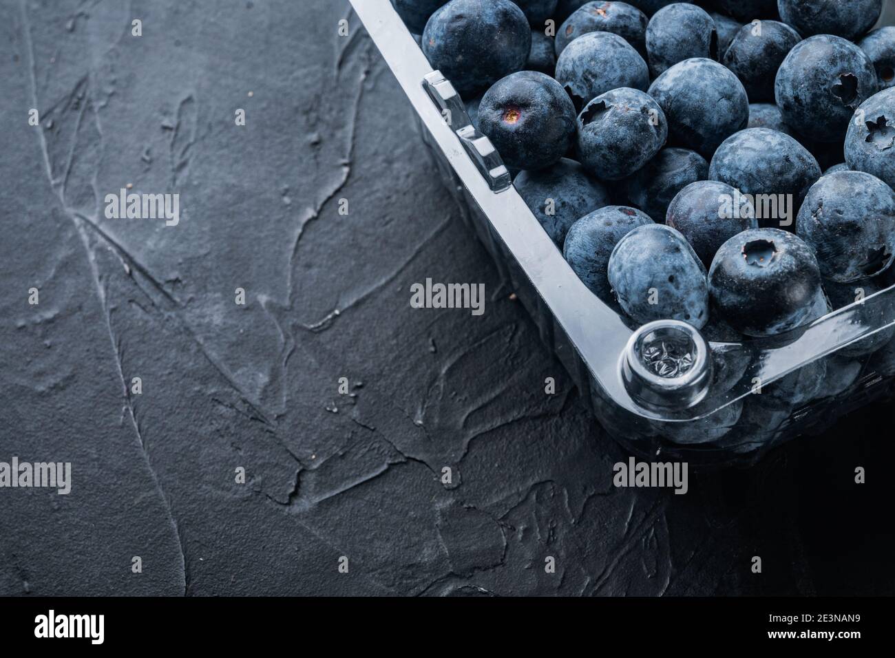 Tray, with blueberry, on black background with copy space for text ...