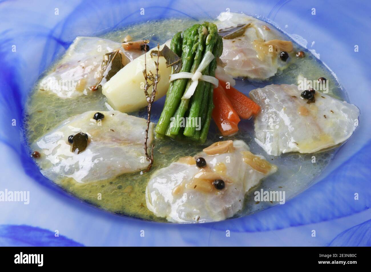 Raw fish carpaccio with green asparagus and black pepper Stock Photo ...