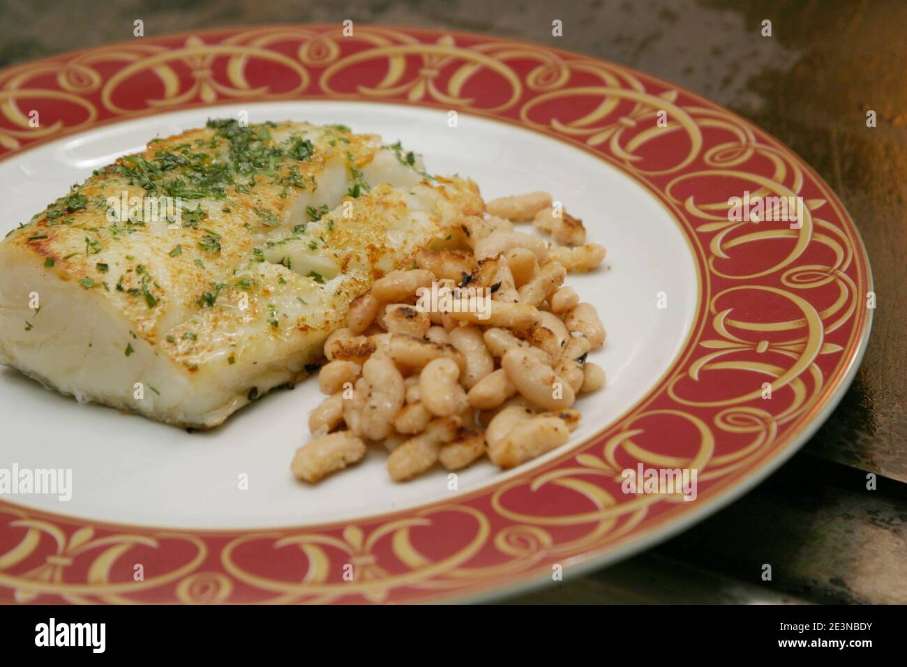 Grilled cod with white beans Stock Photo - Alamy