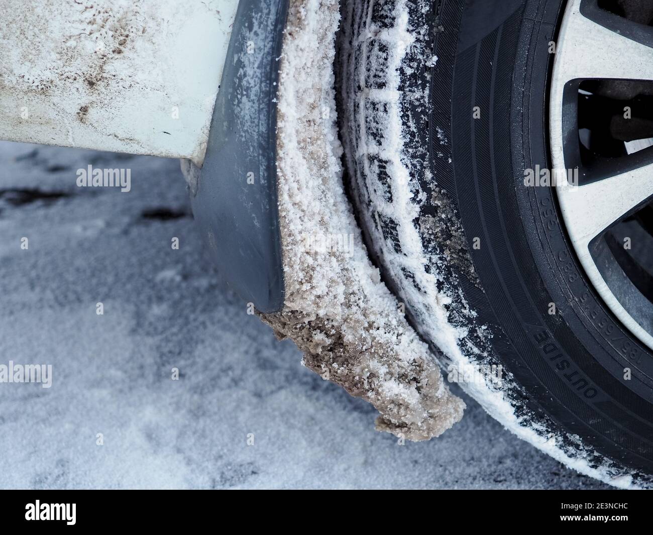 The wheel arch of the car is clogged with ice and snow. Consequences of ...
