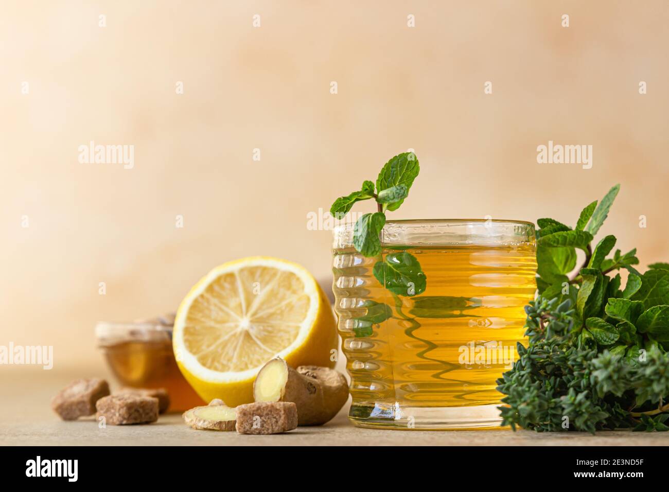 Hot mint and thyme tea with ginger root, lemon and honey, light ...