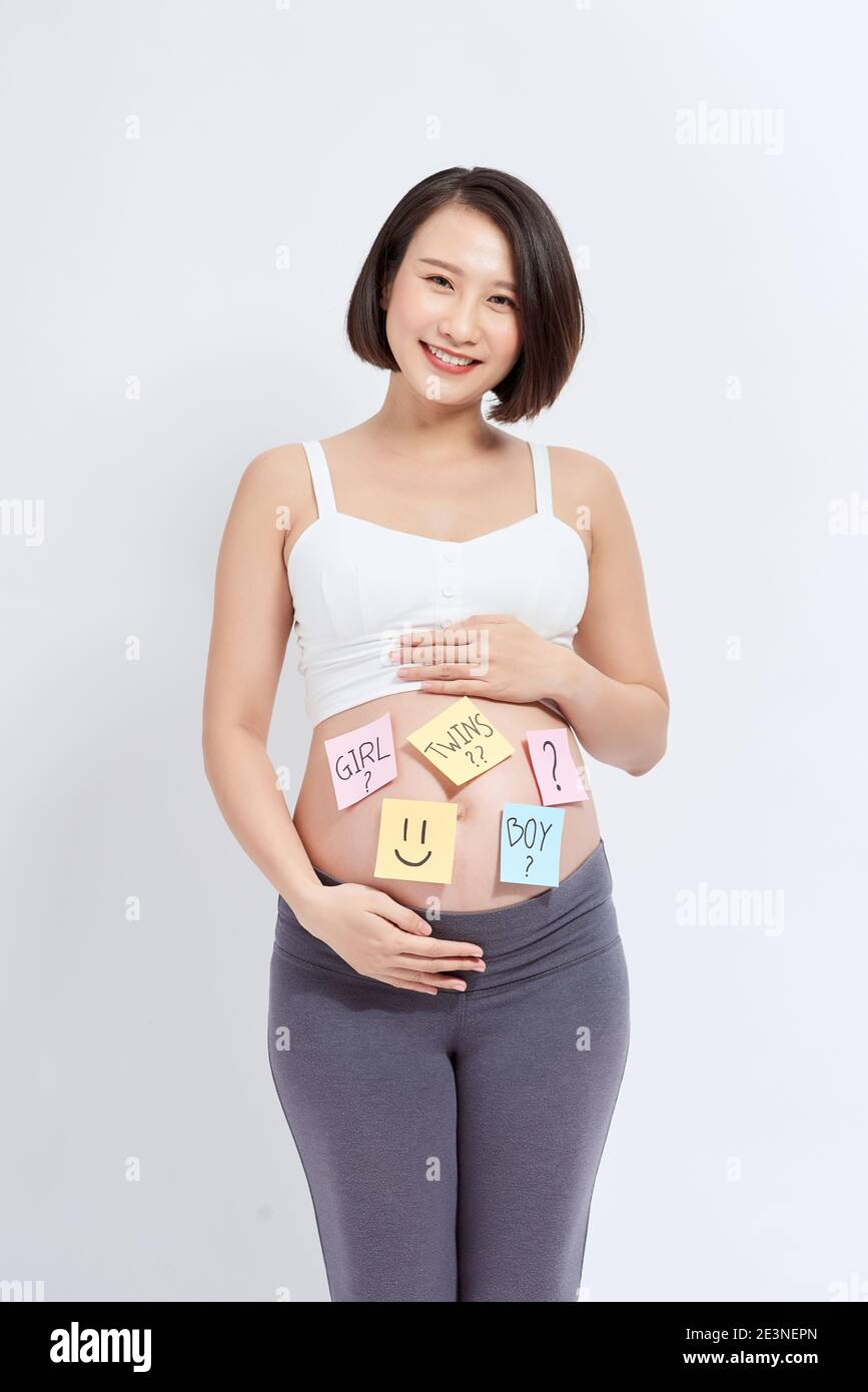 Belly of a pregnant woman with stickers Stock Photo - Alamy