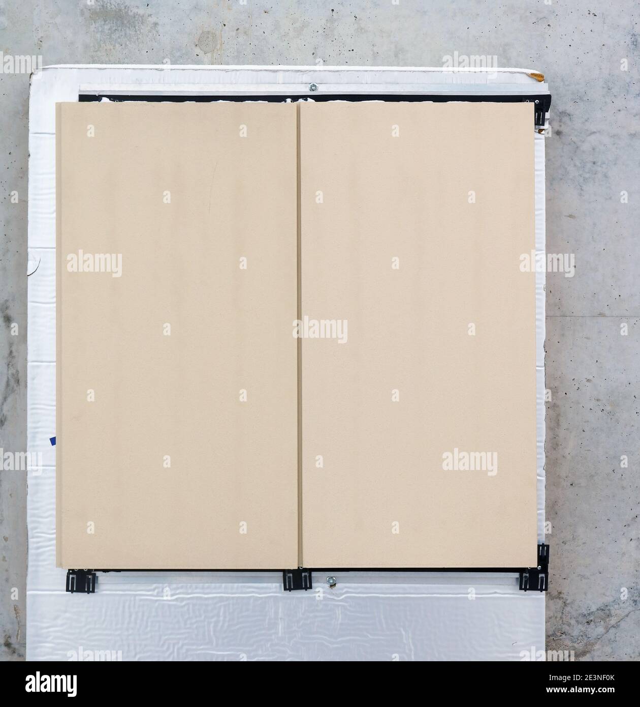 Samples of outdoor stone slabs installed on a gray fresh concrete ...