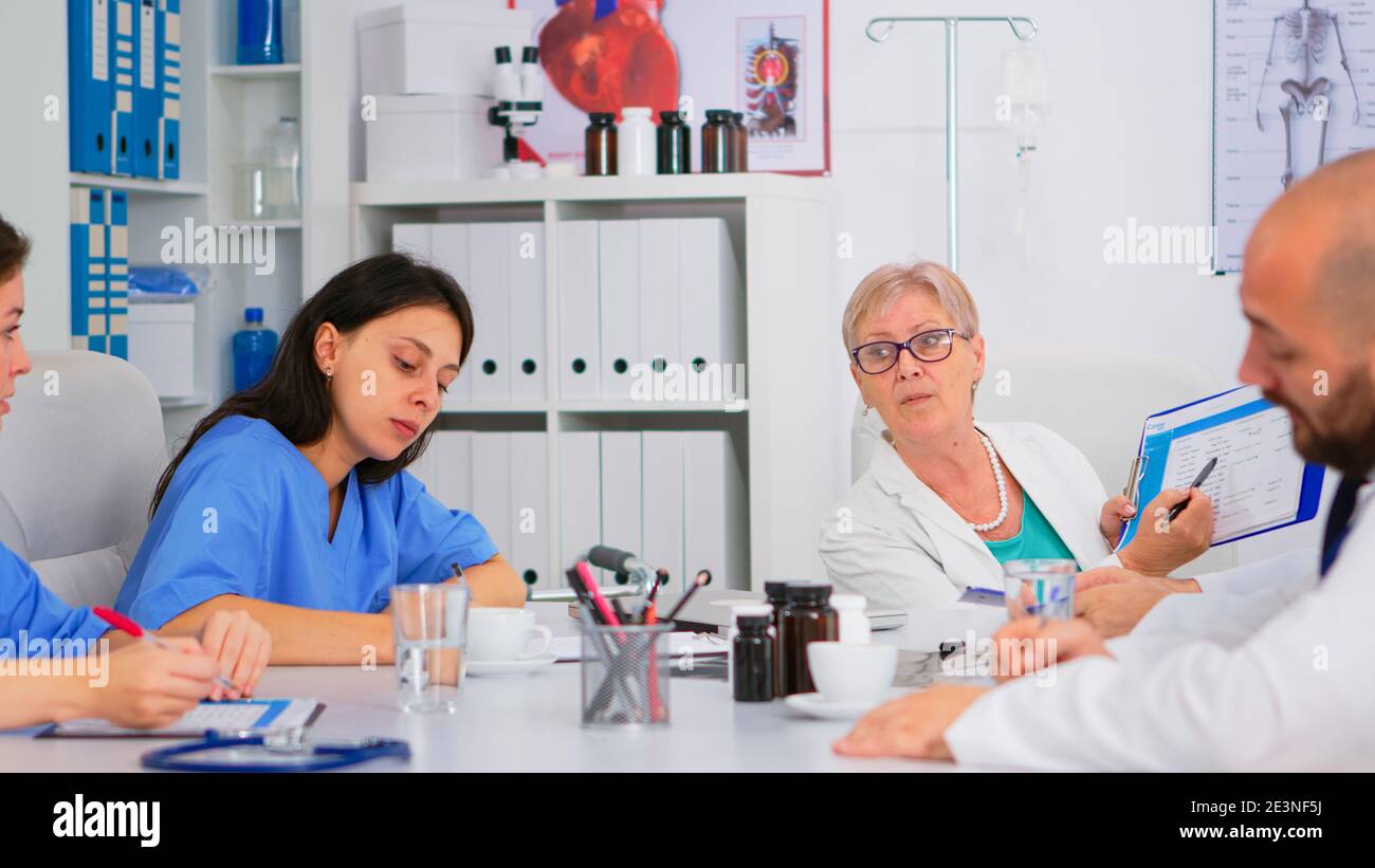 Senior specialist doctor brainstorming analyze hi-res stock photography ...