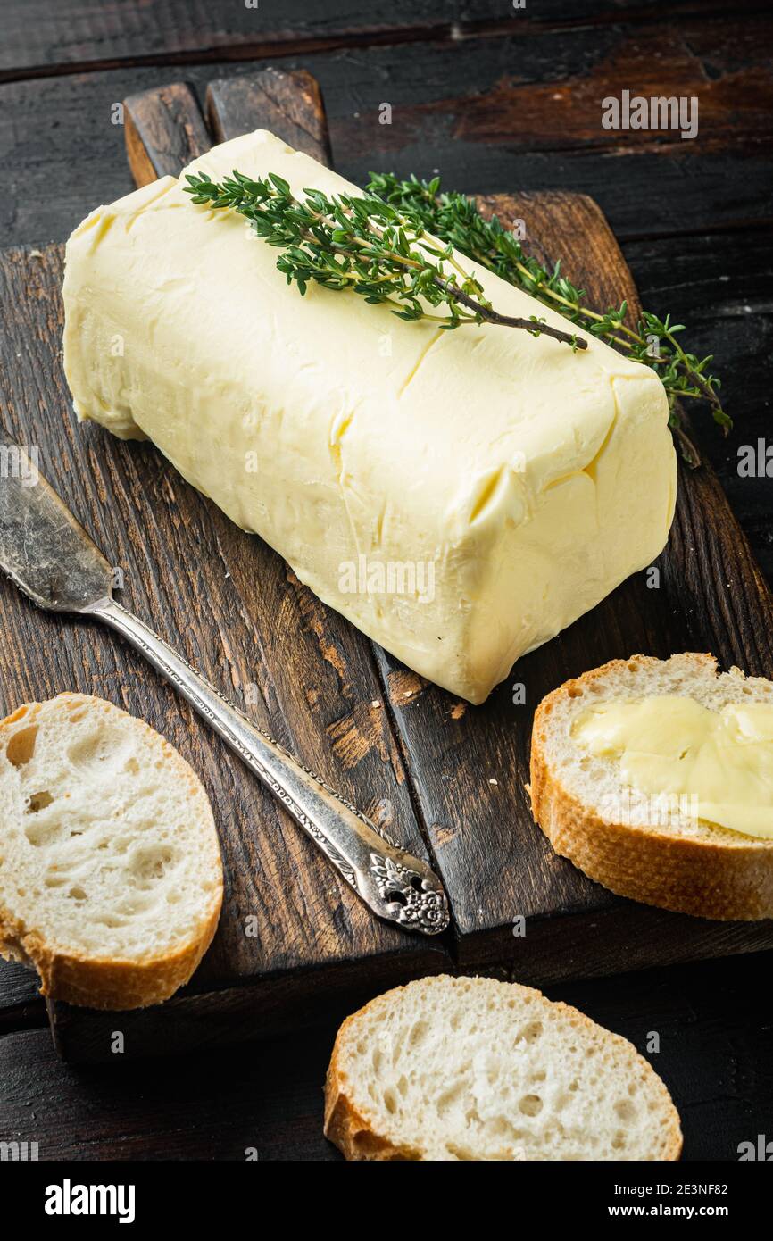 Rustic farmhouse inspired fresh butter, on old dark wooden table ...