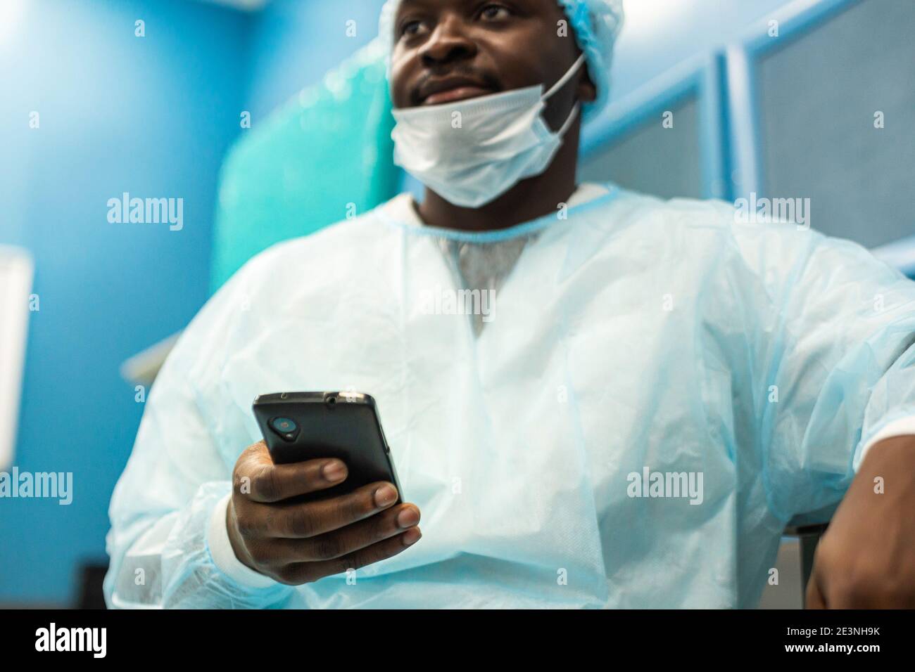 Portrait of a surgeon in uniform and medical mask after the operation ...