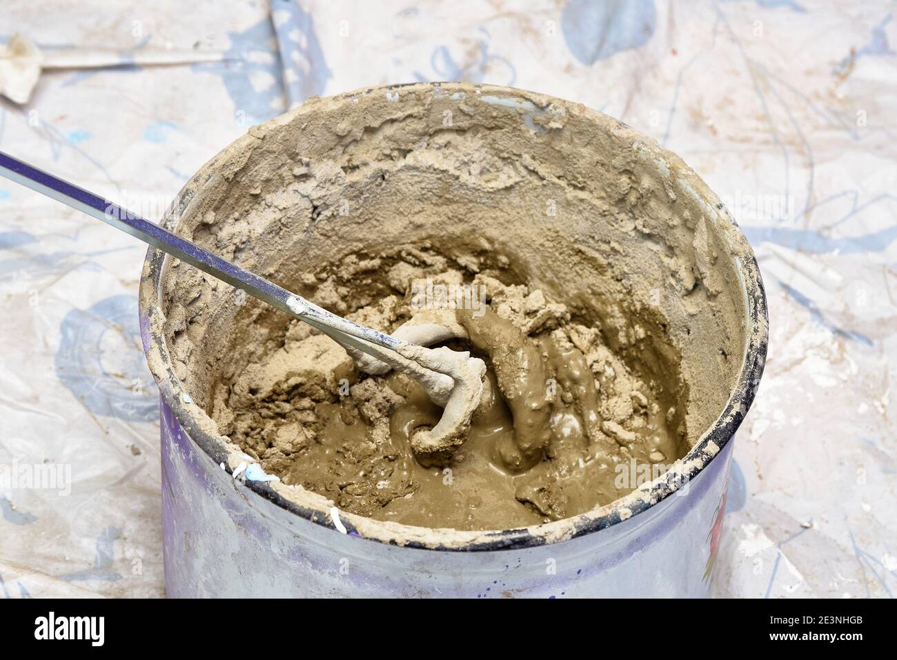 mixing the solution in container. construction, repair Stock Photo - Alamy