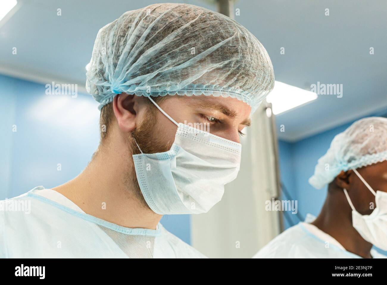 Portrait doctor performing surgical operation hi-res stock photography ...