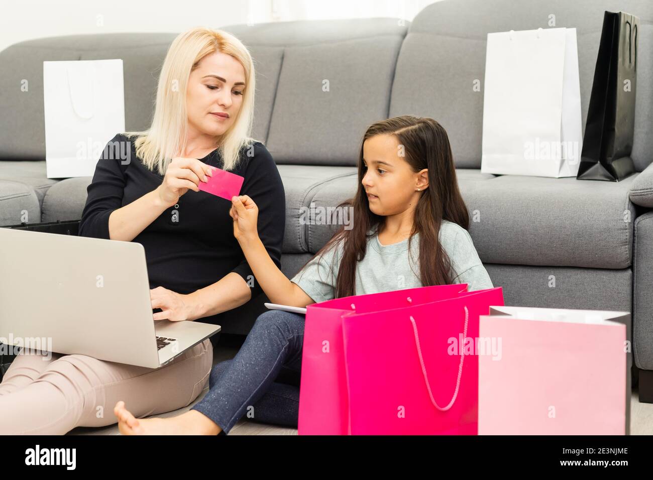picture of happy mother and child with laptop computer, shopping online ...