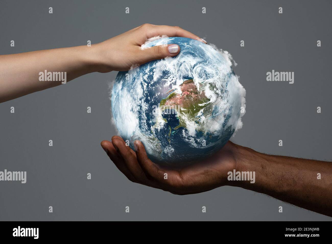 Two hands holding planet Earth, close up. Environment save, taking care ...
