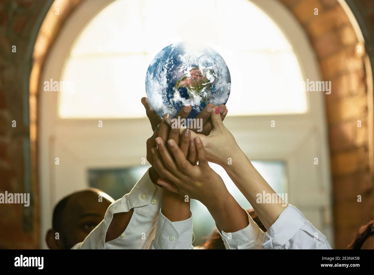 Doctors holding a world globe in hands, concept of world health ...