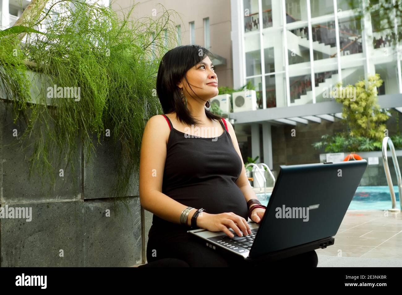 Happy and Active Pregnant Southeast Asian Woman on Her Third Semester ...