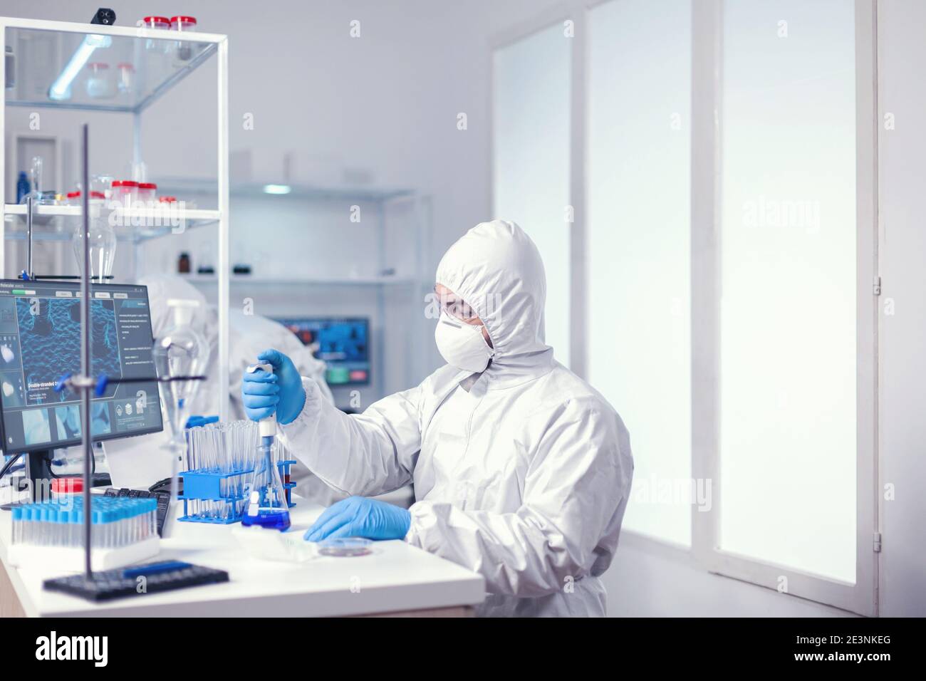Man glasses pipette biochemistry mask hi-res stock photography and ...