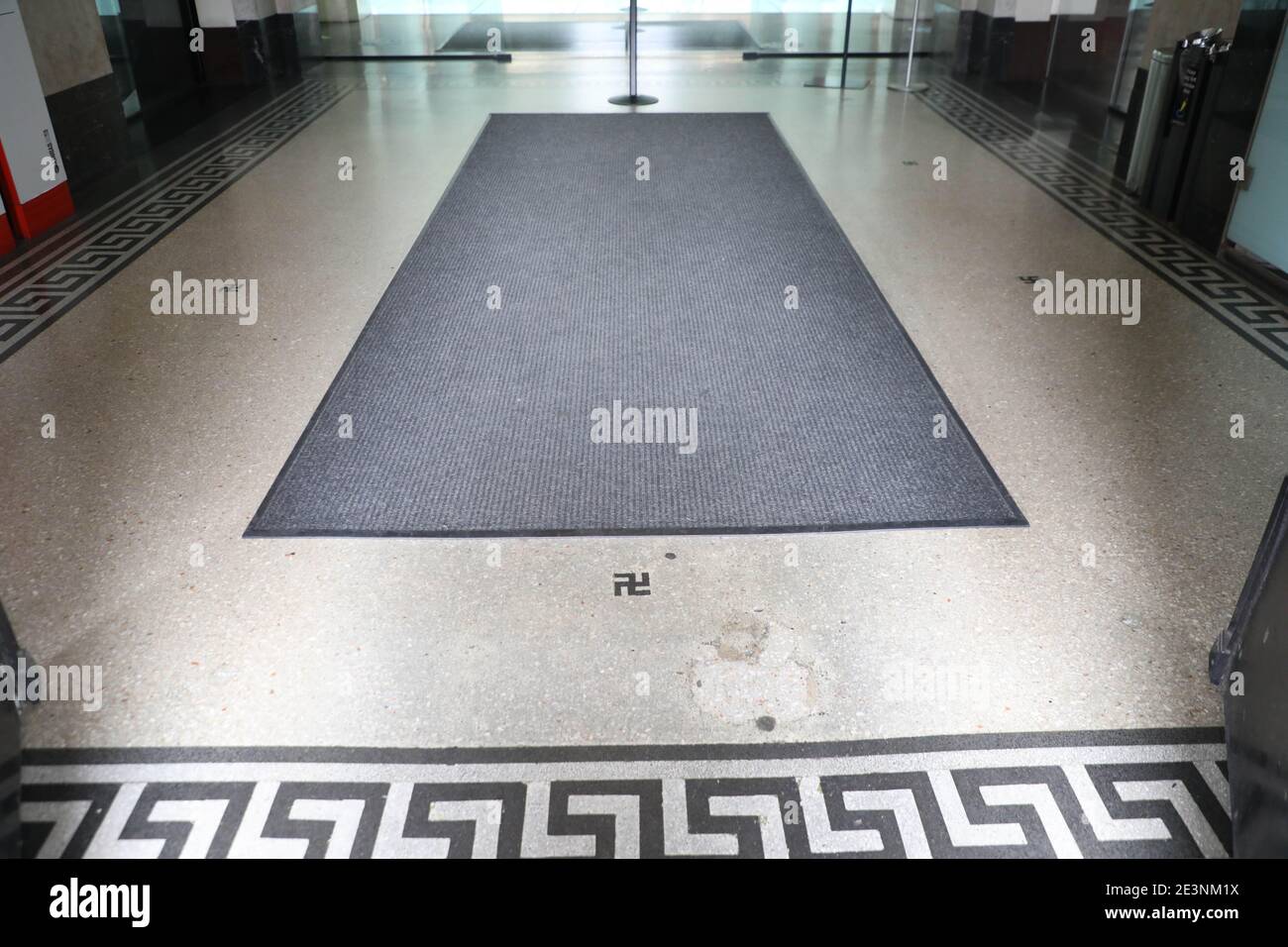 Swastikas on the floor at the entrance to Customs House library in ...