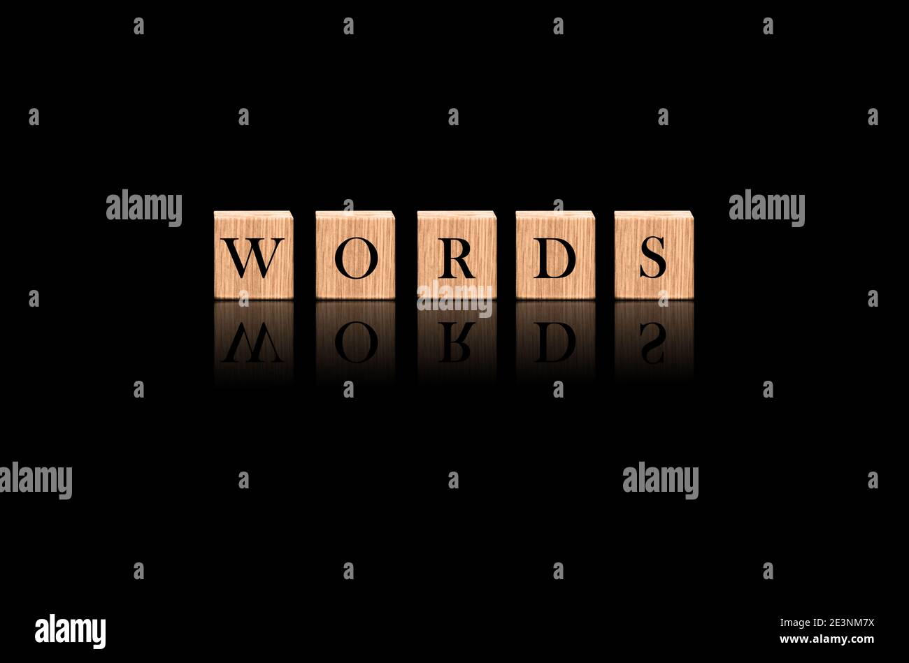 The word "WORDS" mad by wood blocks in solid black background Stock ...