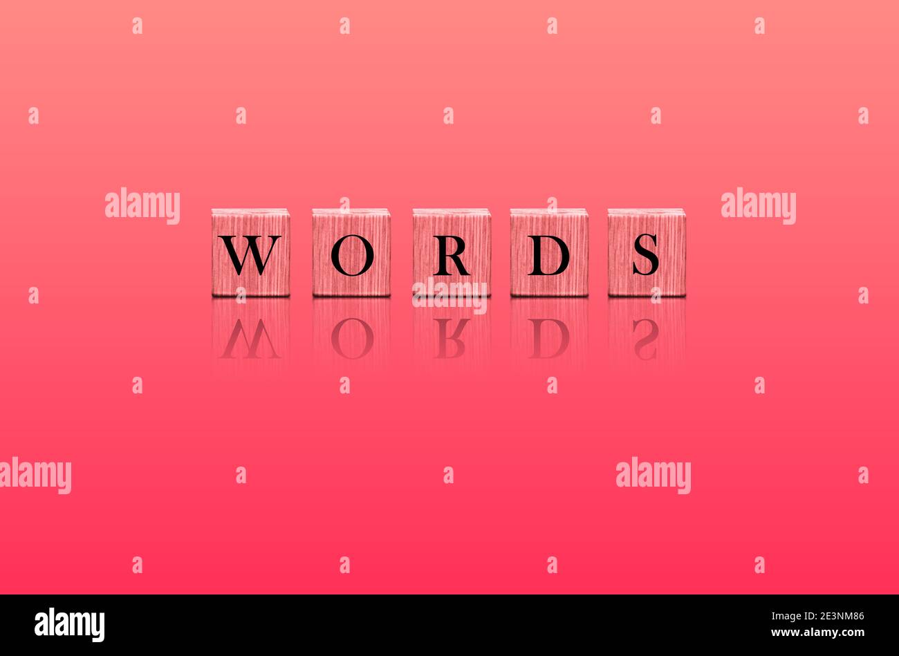 The word "WORDS" mad by wood blocks in gradient lovely red background ...