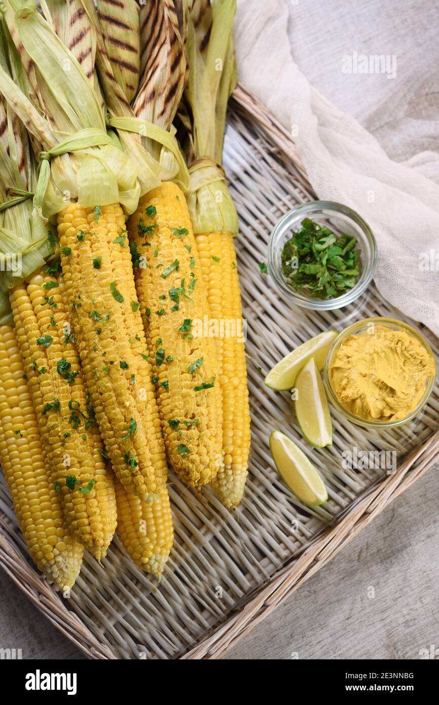Tender, juicy grilled corn on the cob, seasoned butter with spicy curry ...