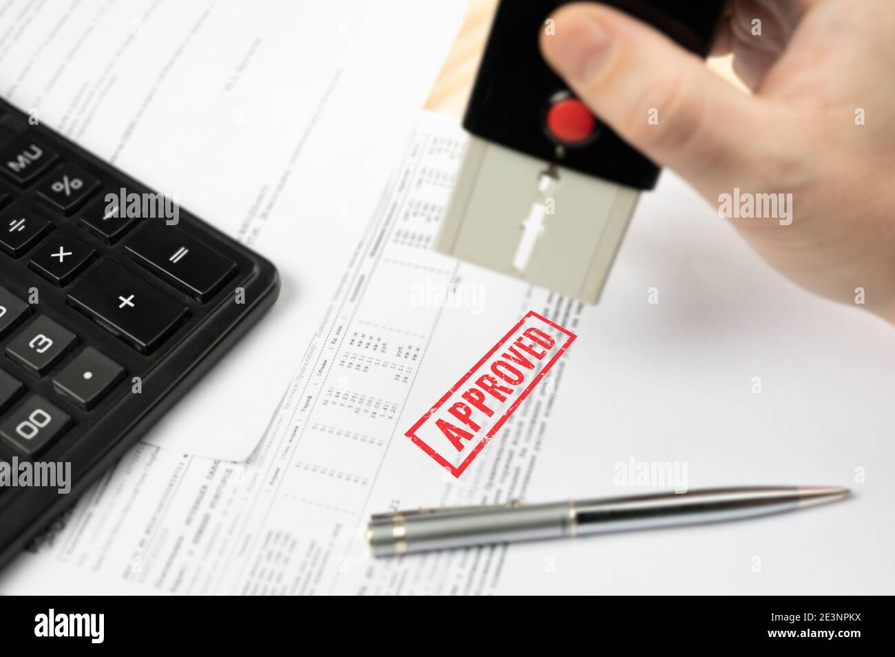 approved stamp. Close-up Of A Businessperson's Hand Stamping On ...