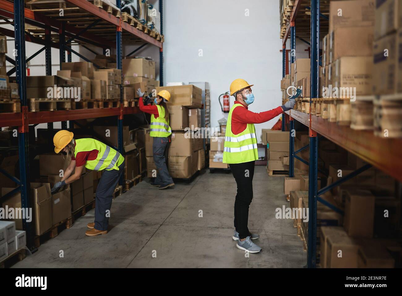Industrial worker people inside warehouse wearing safety masks for ...