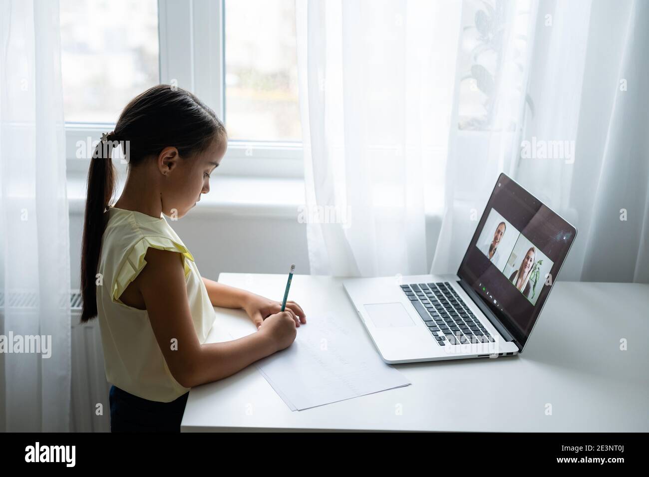 cheerful young little girl children using laptop computer, studying ...