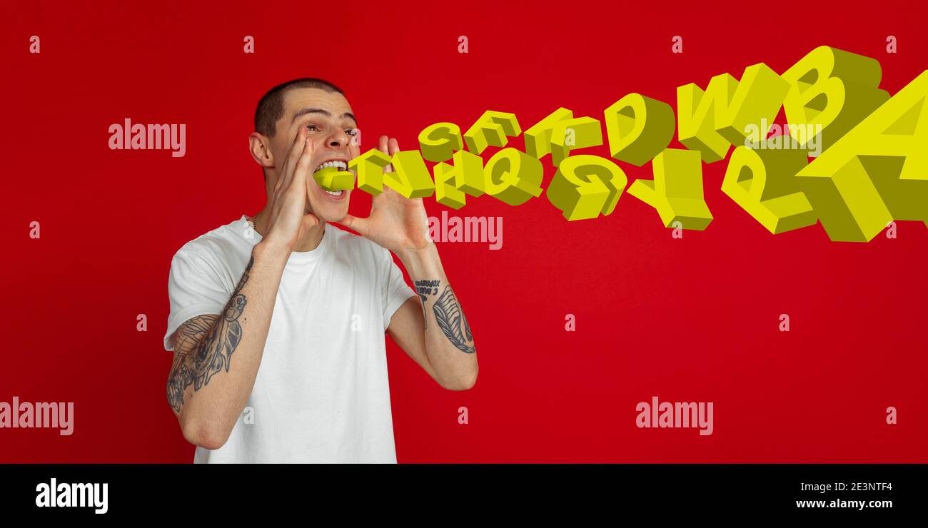 Man shouting, screaming angry, highly tensioned on red studio ...