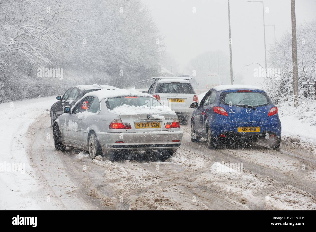 Cars struggle to get up a hill in the snow Barnsley, South Yorkshire ...