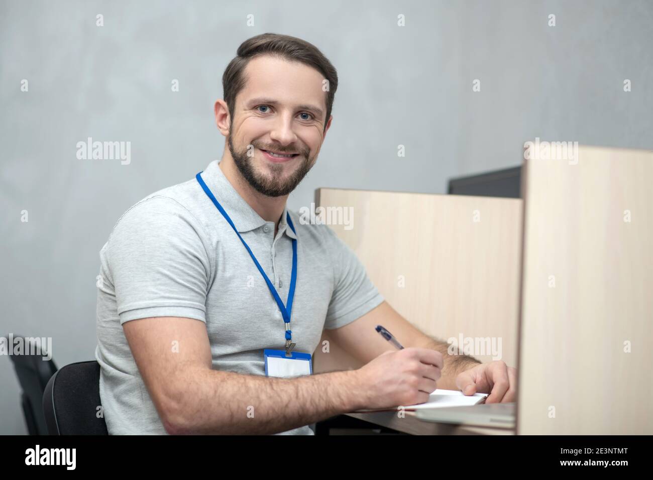 Man with badge hi-res stock photography and images - Alamy