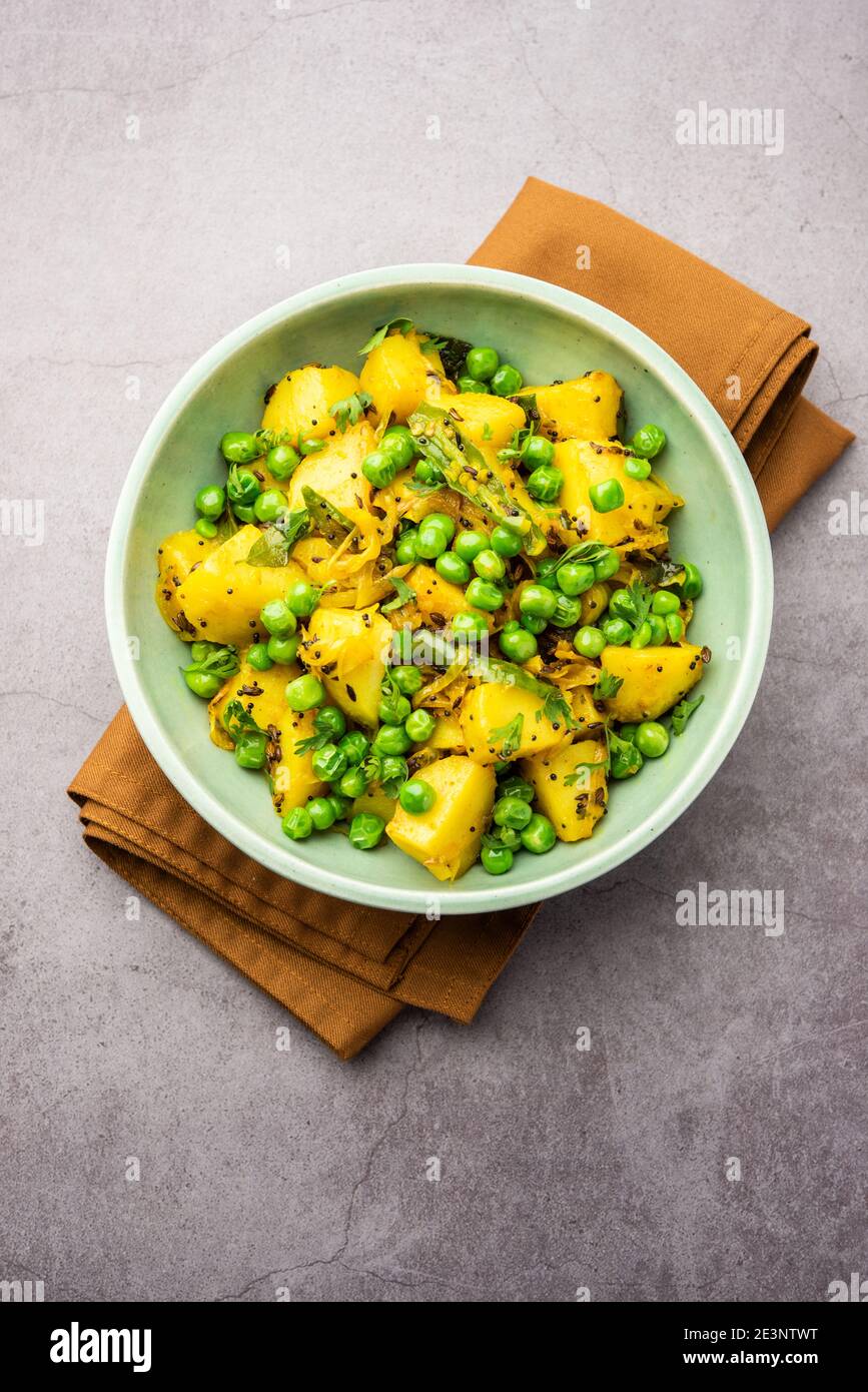 Aloo Mutter or Matar aalu dry sabzi, Indian Potato and green Peas fried ...
